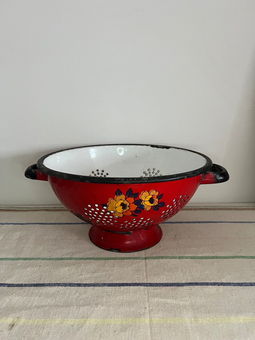 A Solid yet Well Used Red and White Vintage Enamel Colander With a ...