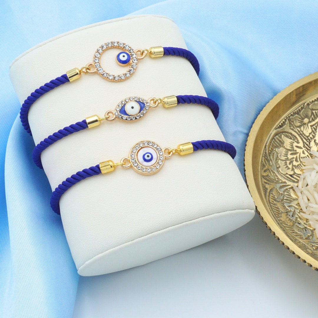 Utsawe Rakhi | Elegant Evil Eye Rakhi With Royal Blue Cord | Perfect for Brothers of All Ages ...