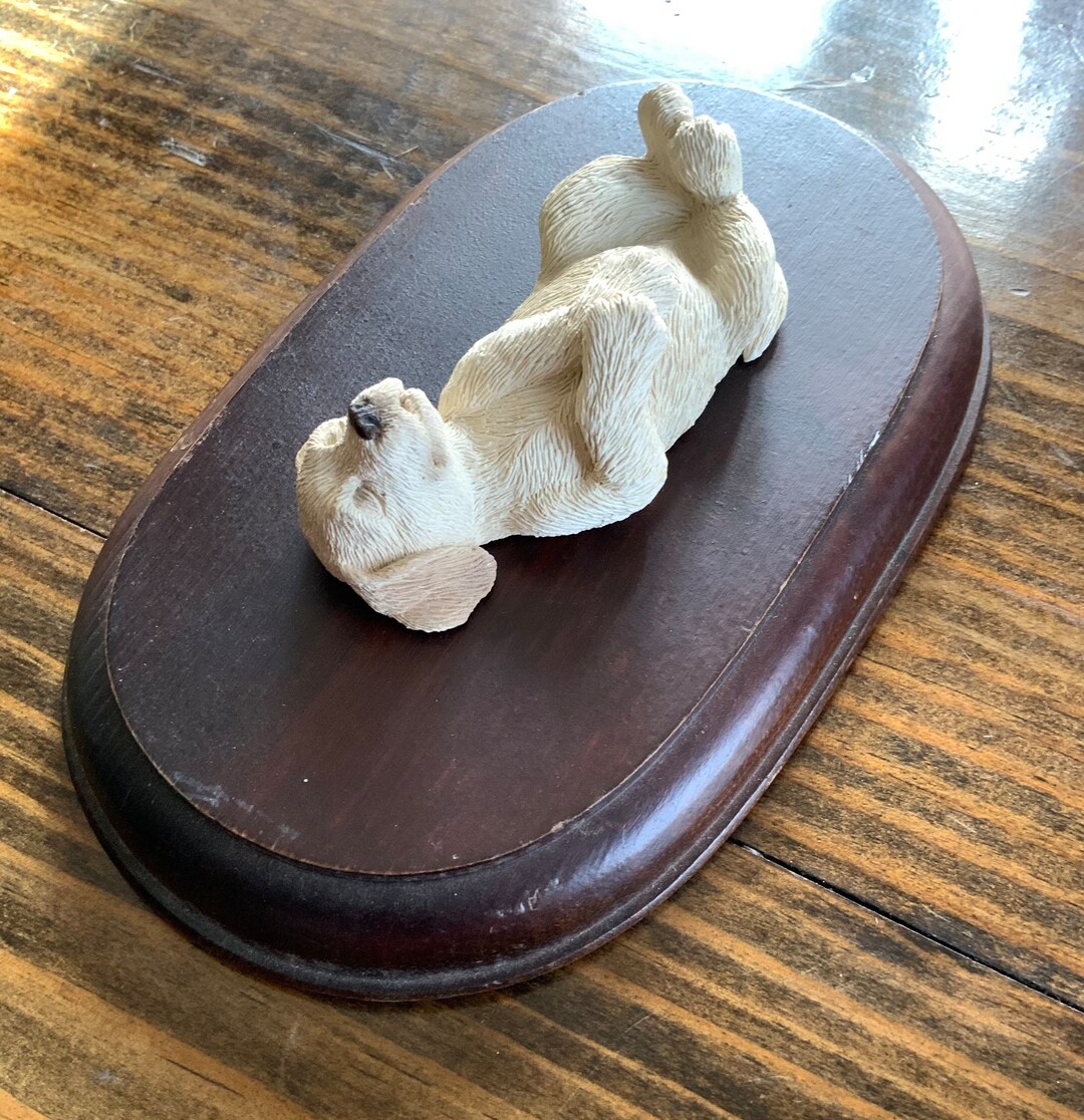 Vintage Sandicast Sleeping on His Back Golden Puppy on Wooden Platform ...