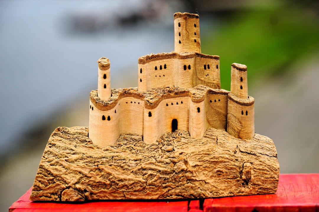 Wooden Pop up Castle Carved From a Garden Tree Log Expending Into a ...
