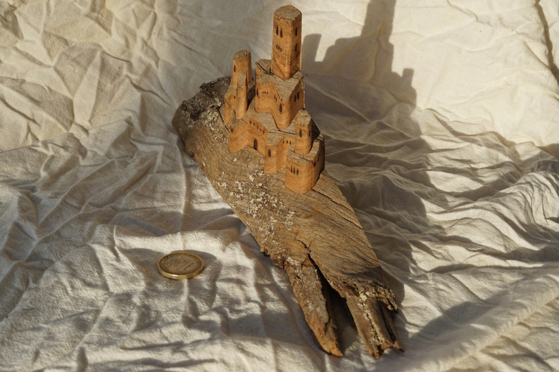 Wooden Pop up Castle Carved From a Driftwood Log Expending Into a ...