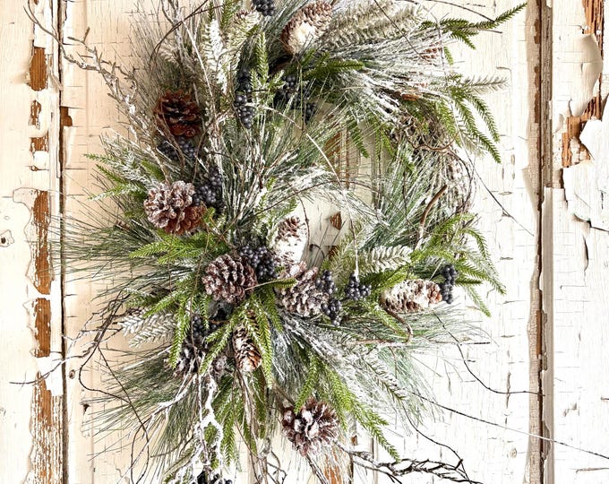 Winter Wreath With Snow-flocked Greenery, Pinecones & Blueberries ...