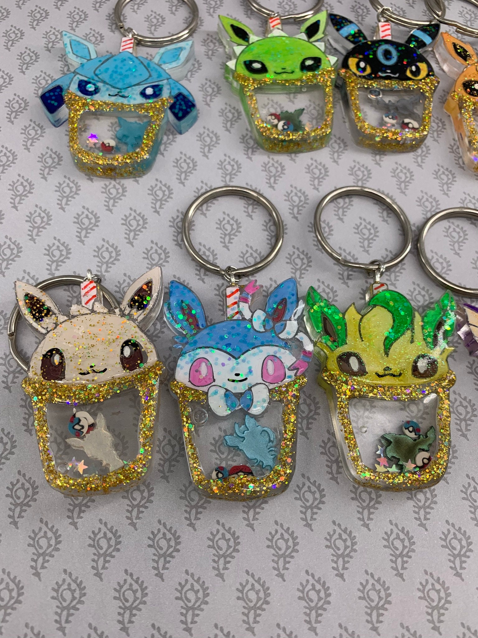 Shiny Poke Shaker Cup Anime Keychains Eevee Eeveelutions | Etsy