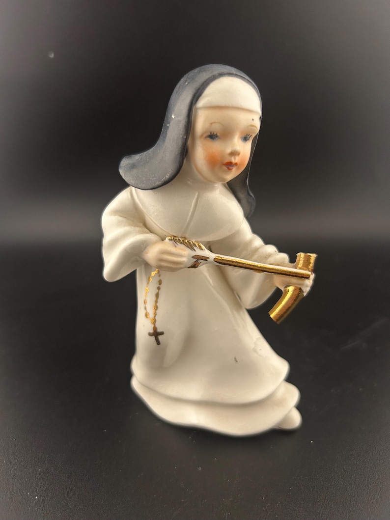 Vintage NAPCO Japan Ceramic Catholic Nun With Arrow and Broken Bow. as ...