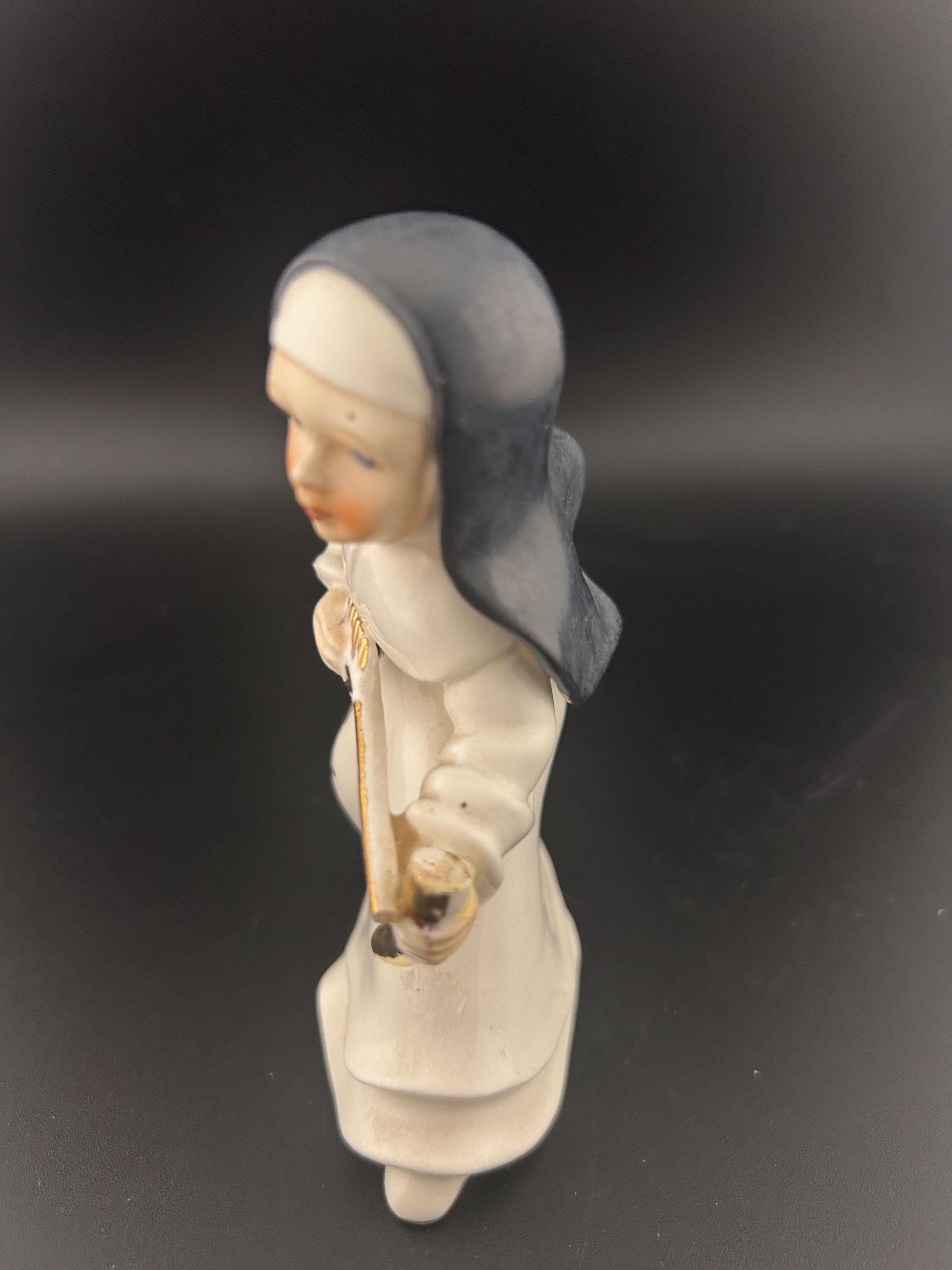 Vintage NAPCO Japan Ceramic Catholic Nun With Arrow and Broken Bow. as ...