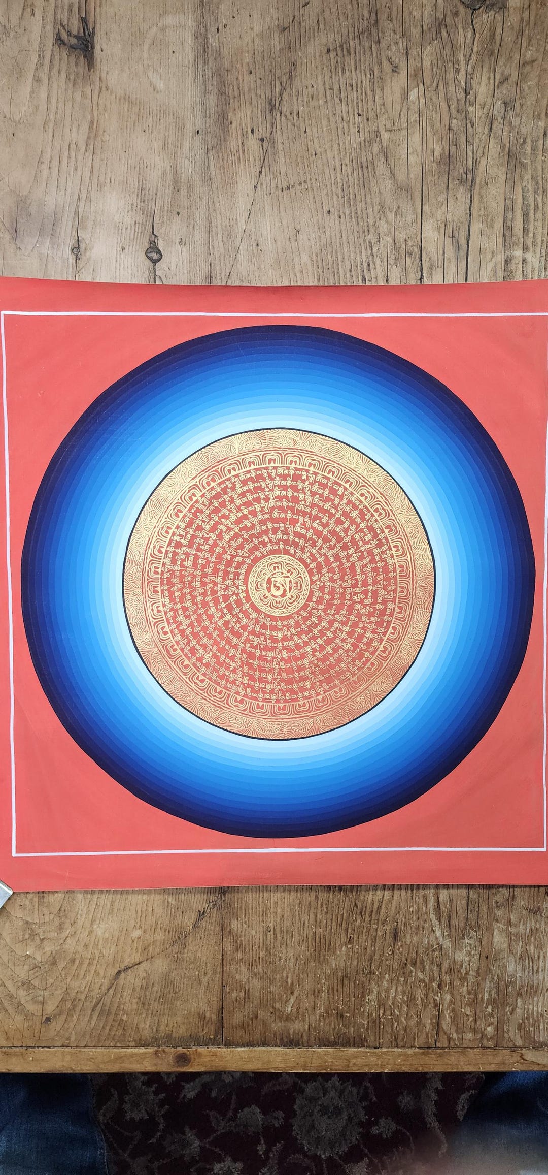 Sacred Blue Rainbow on a Red Mantra Mandala Thangka Painting. Om Mani ...