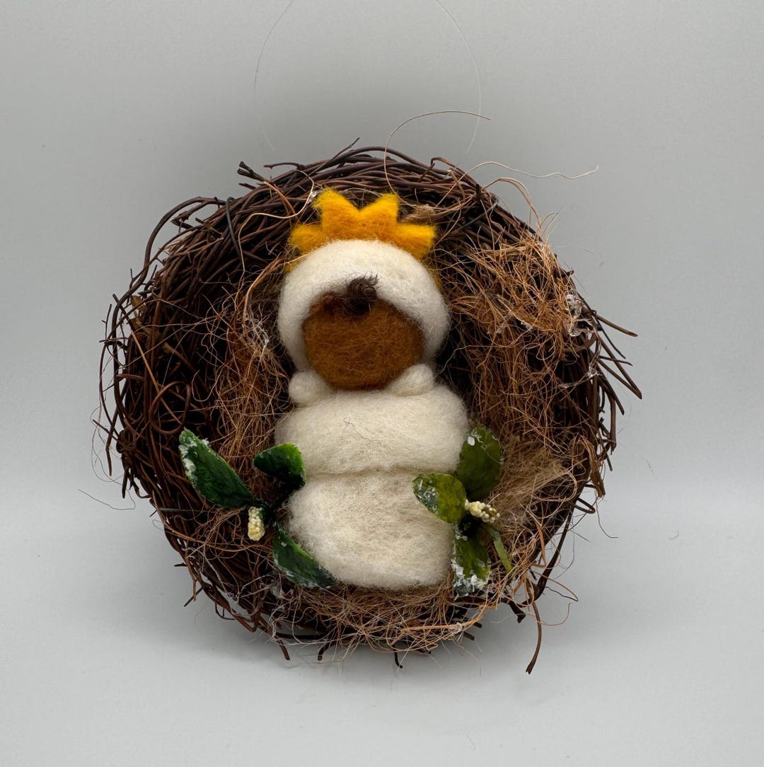 Needle Felted Wool Dark Skin Baby Jesus Curled up on a Bed of Soft Hay ...