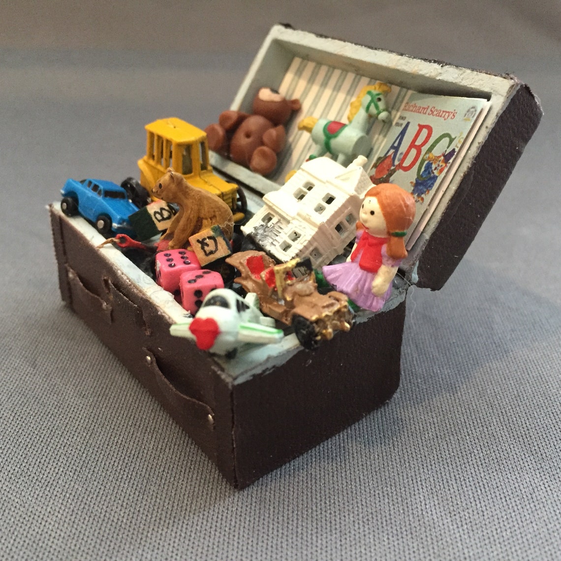 A dollhouse miniature toy chest with toys for girls and boys. | Etsy