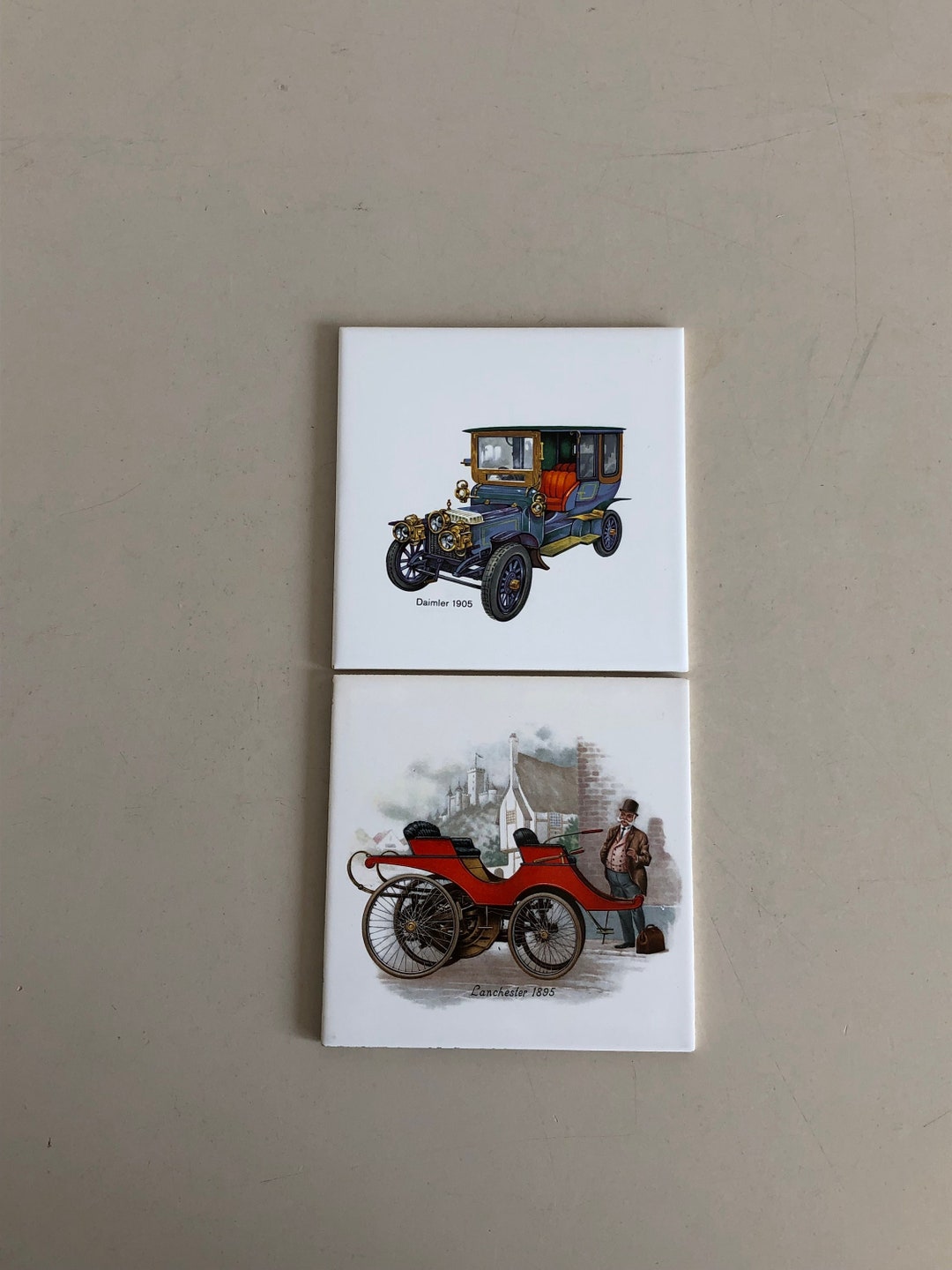 2 Decorative Tiles - A.o. by Mettlach - Decoration Daimler 1905 and Lanchester 1895 - Porcelain ...