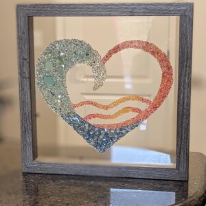 A Pretty, Ocean, Sunset Scene With Sea Glass and Gliterring Crushed ...