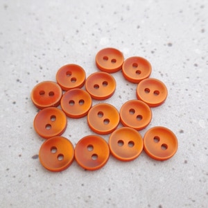 small orange buttons