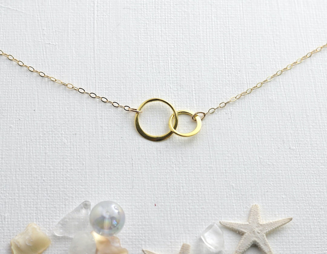 Interlocking circle necklace meaning store