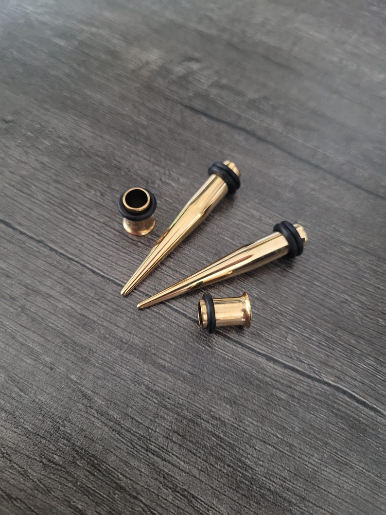 Pair 1g 7mm Gold Steel Tapers and Gold Single Flare Tunnels Ear ...