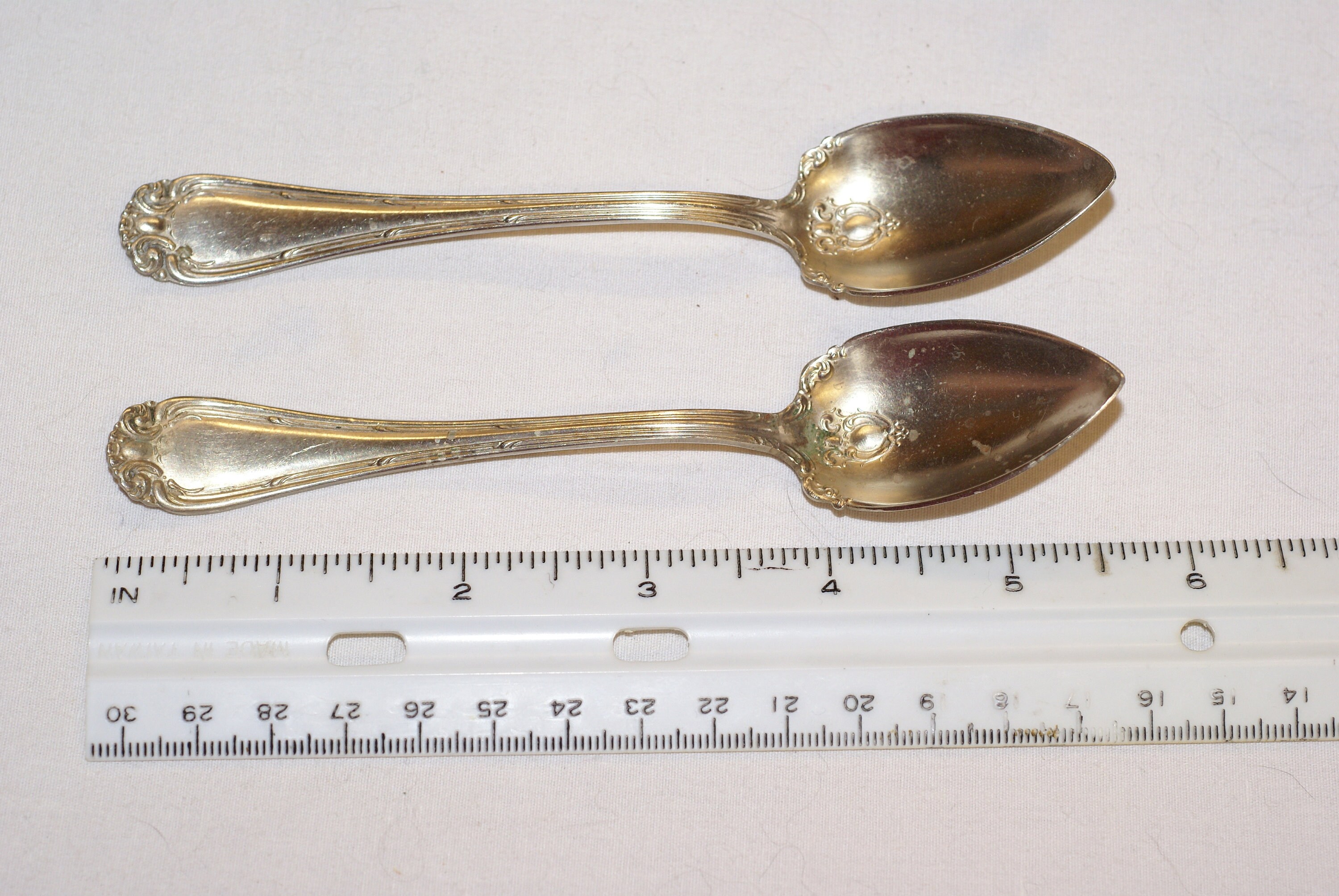 A Pair of Unique Nickel Silver Spoons with Extensive Engraving front ...