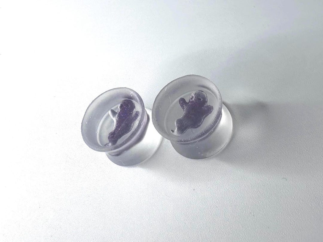 A Pair of 14mm Clear Squishy Silicone Plugs With Purple Ghosts for ...