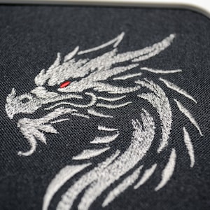 Silver Dragon Head Embroidery Design - Power Emblem for Dark Fabric ...