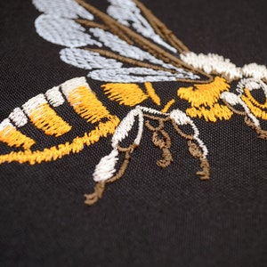 Realistic Honeybee Embroidery Design - Lifelike Bee Art on Black Fabric ...