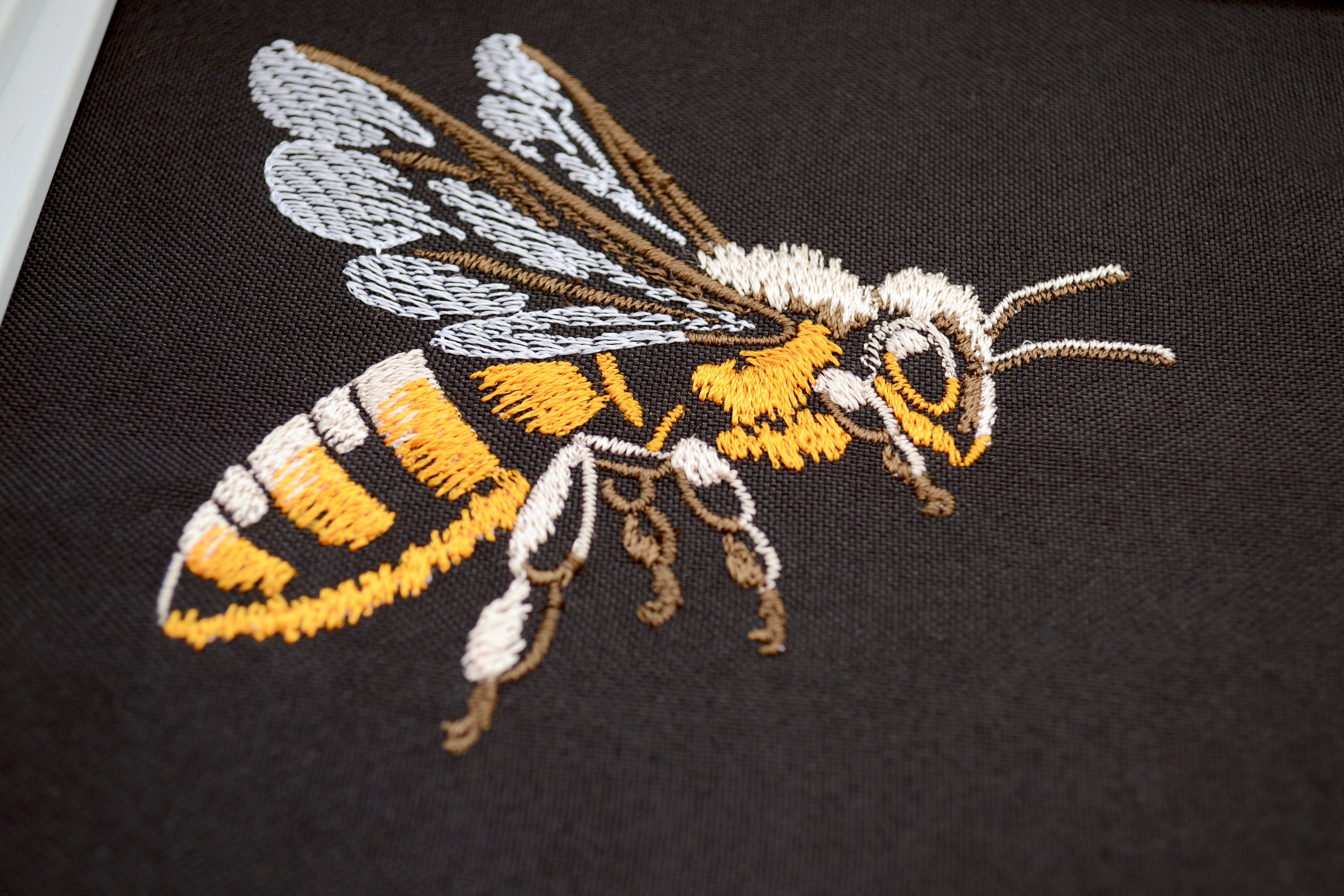 Realistic Honeybee Embroidery Design - Lifelike Bee Art on Black Fabric ...