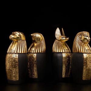 Ancient Egyptian Canopic Jars Set Symbol of Eternity and Royal Funerary ...