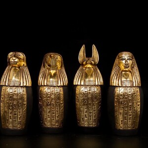 Ancient Egyptian Canopic Jars Set Symbol of Eternity and Royal Funerary ...