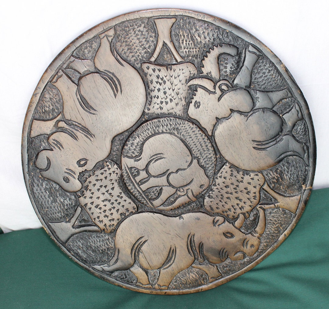 African Carved Wooden Disc, a Picture of People, Elephants, a Rhino and ...