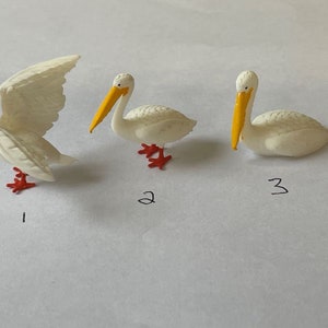 Miniature Pelican Figurine: Hand-painted Resin Coastal Decor - Etsy