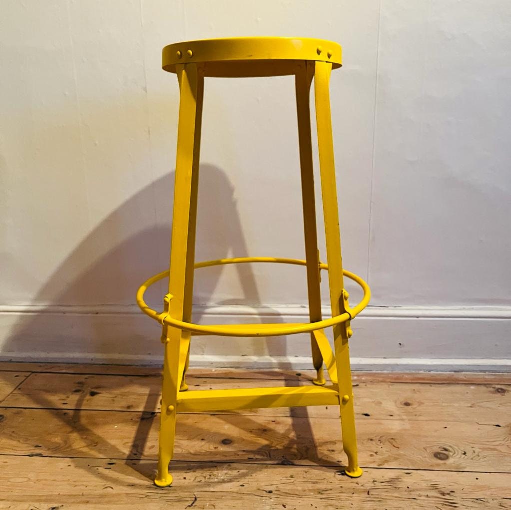 Yellow metal stools store