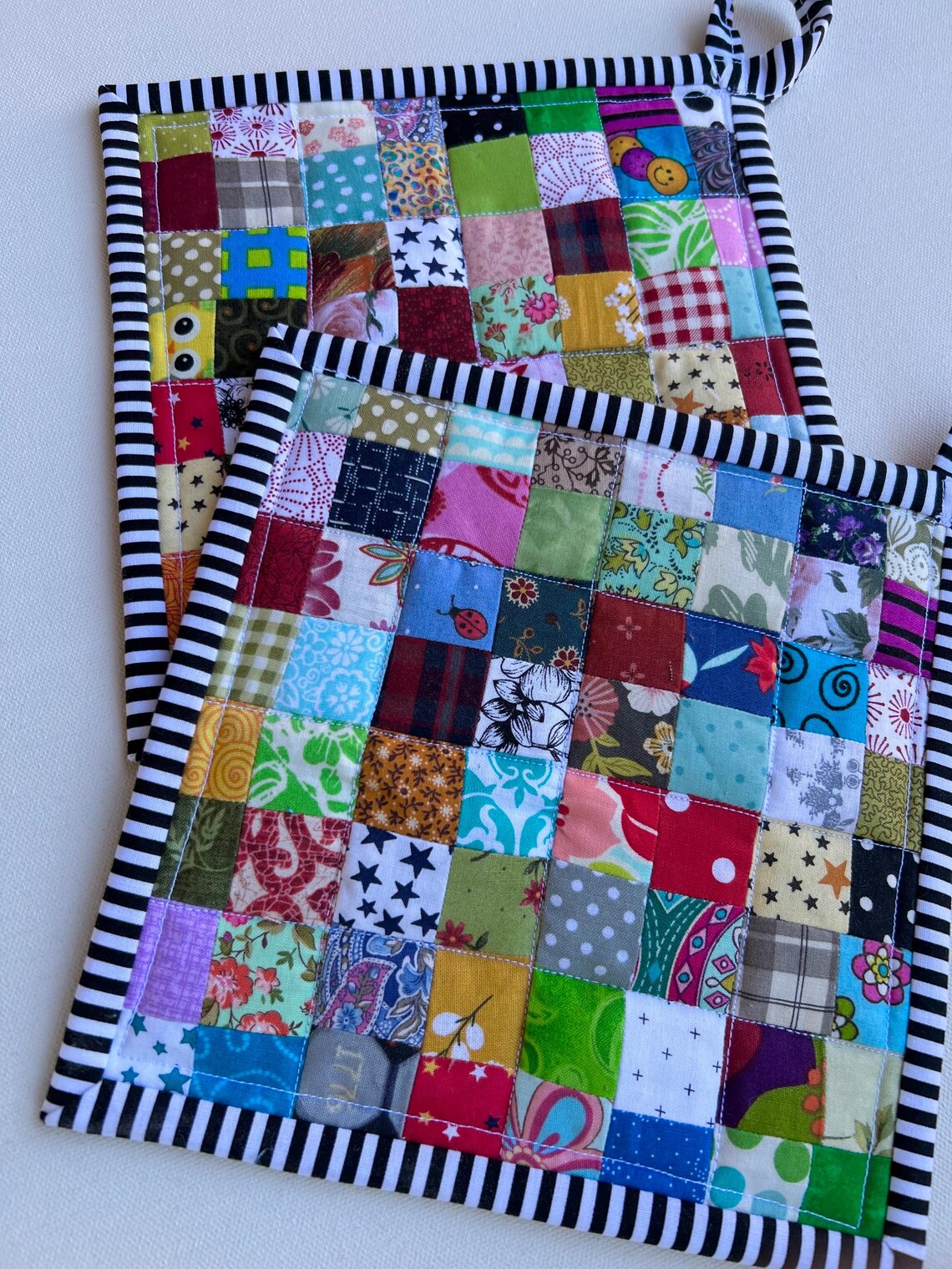 Set of Two Patchwork Potholders Hot Pads Trivets Postage Stamp Squares ...