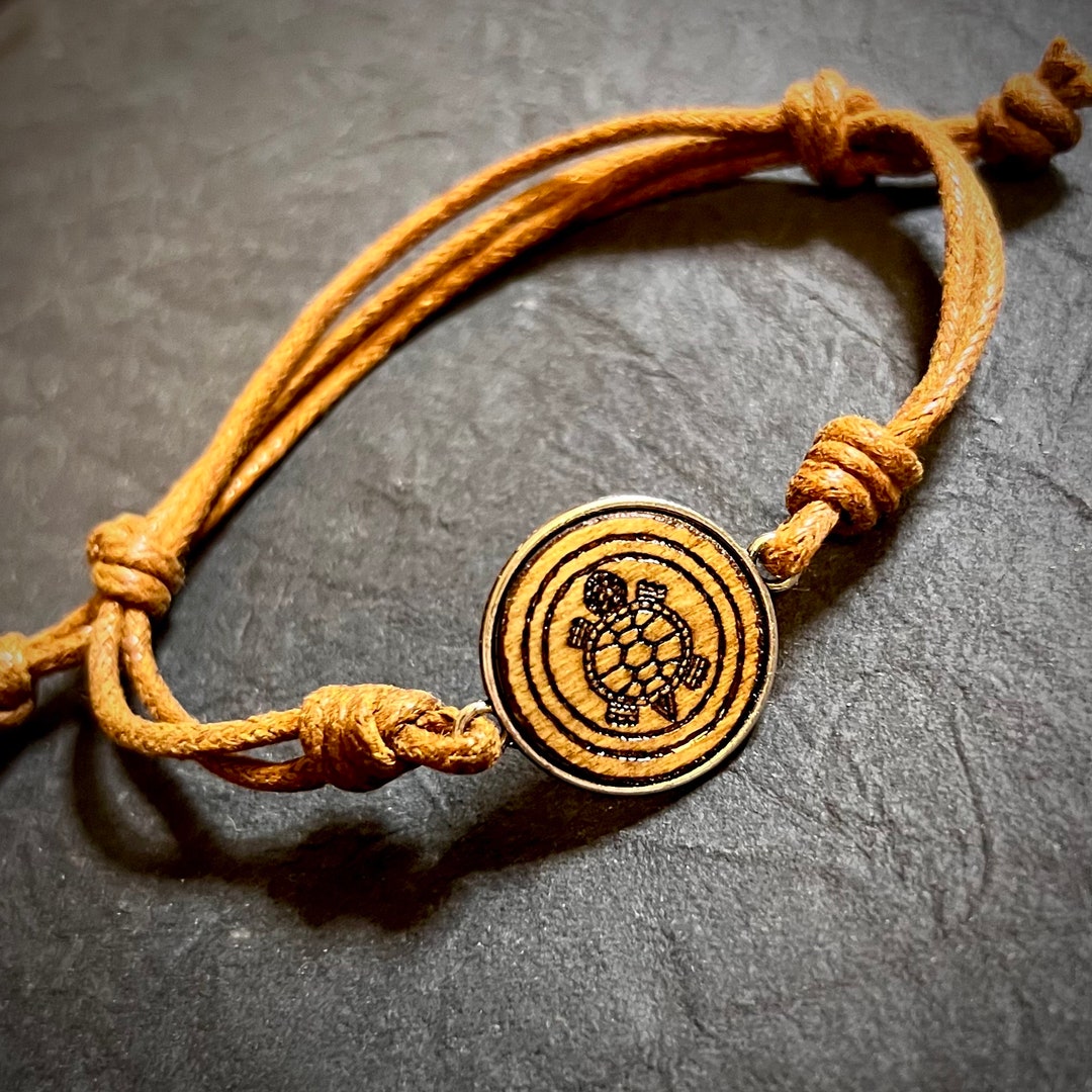 Cherokee Symbol for Adaptability Wood Engraved Metal Bezel Slip Cord ...