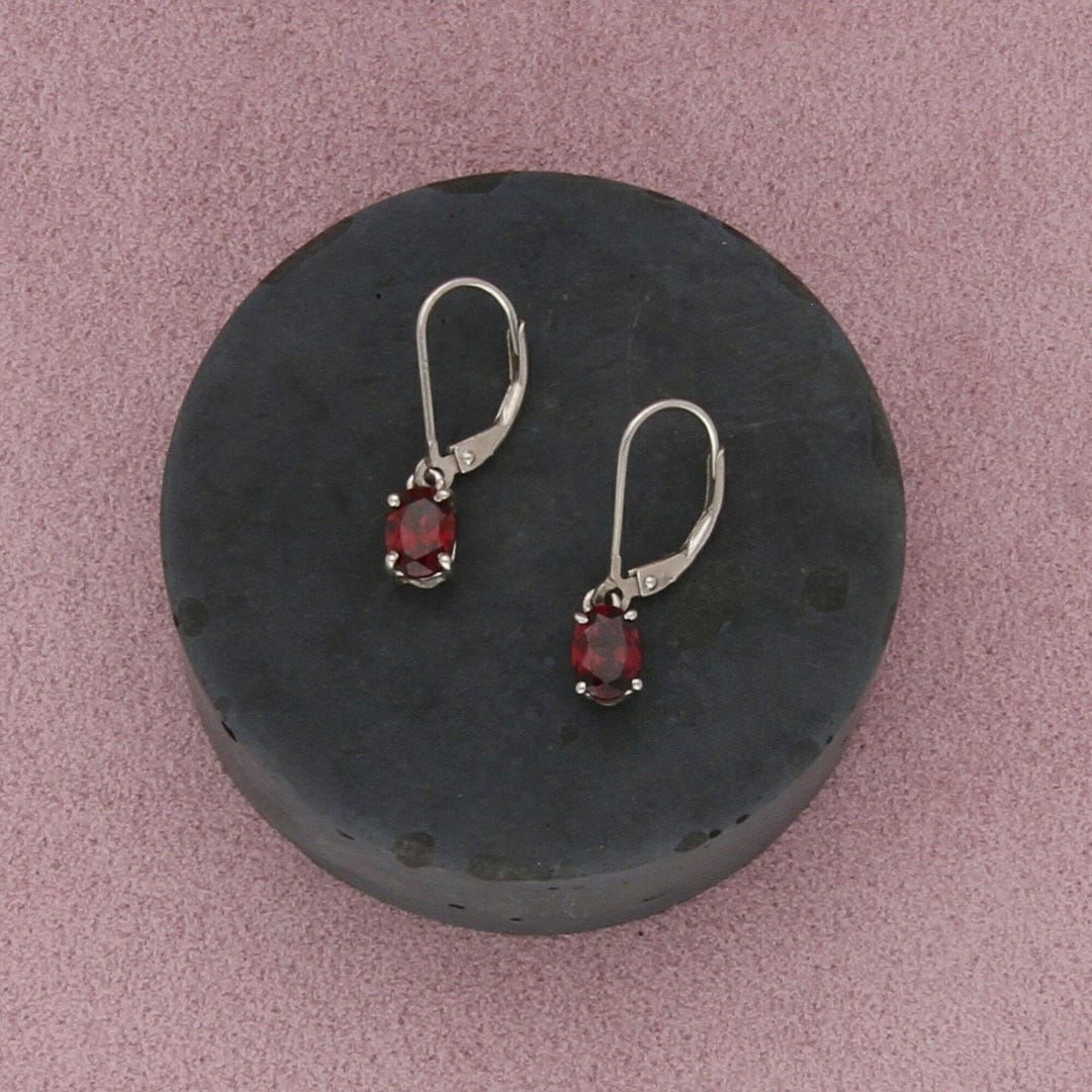 Chuck Clemency Sterling Silver Oval-cut Garnet Dangle Leverback ...