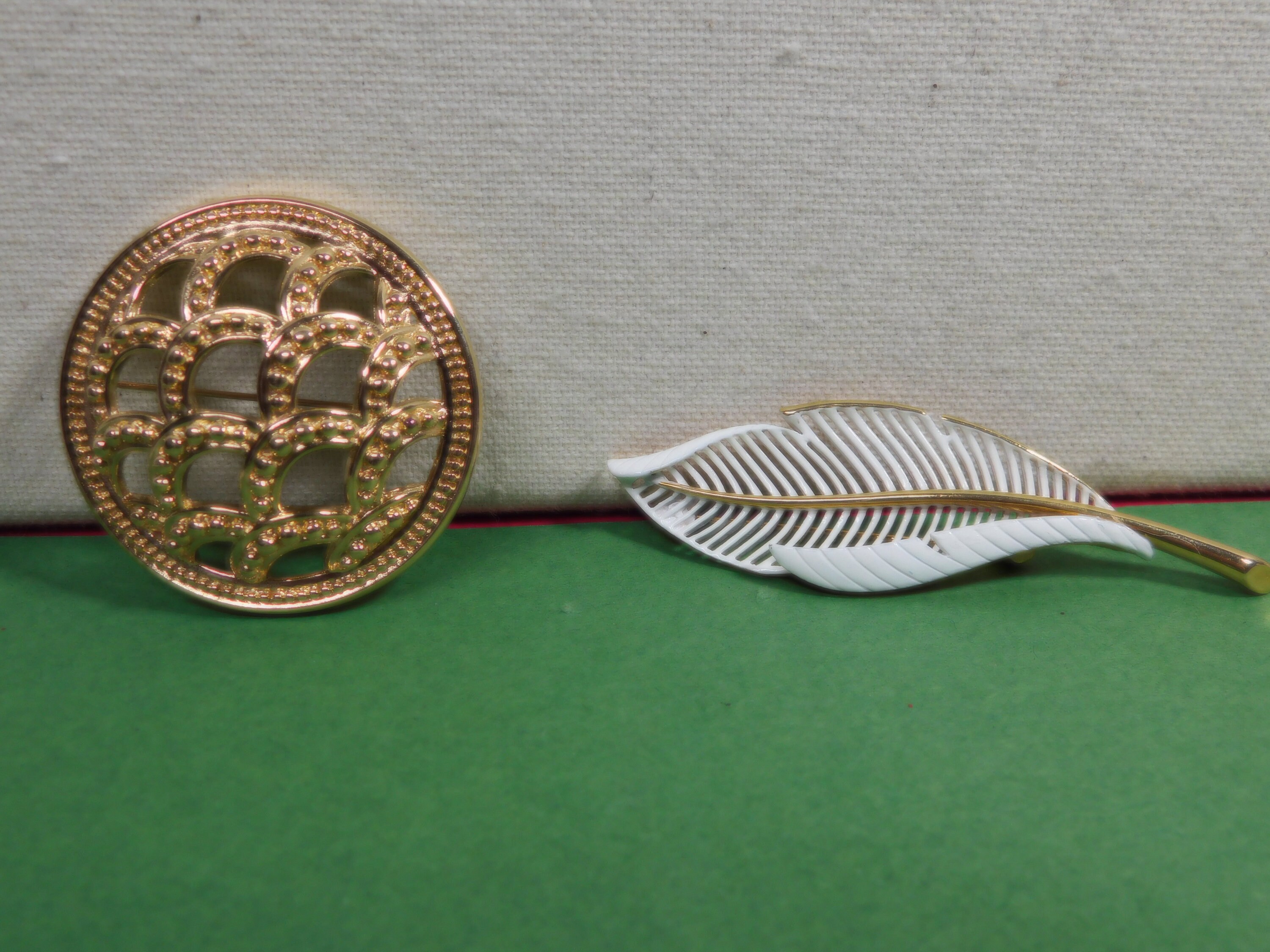 Vintage Monet pins brooches a white enamel leaf and a round wave like ...