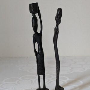 African Ebony Stick Figures. "skinny Art". Two Standing and One Letter ...