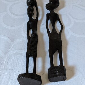 African Ebony Stick Figures. "skinny Art". Two Standing and One Letter ...