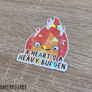 A Heart's a Heavy Burden Sticker | Holographic Sticker, Calcifer ...