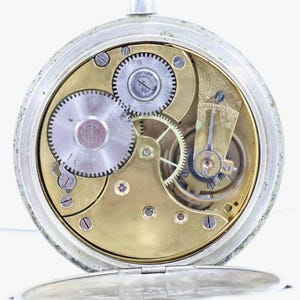 Vintage Omega Pocket Watch | Collector's Timepiece | Nostalgic Paper ...