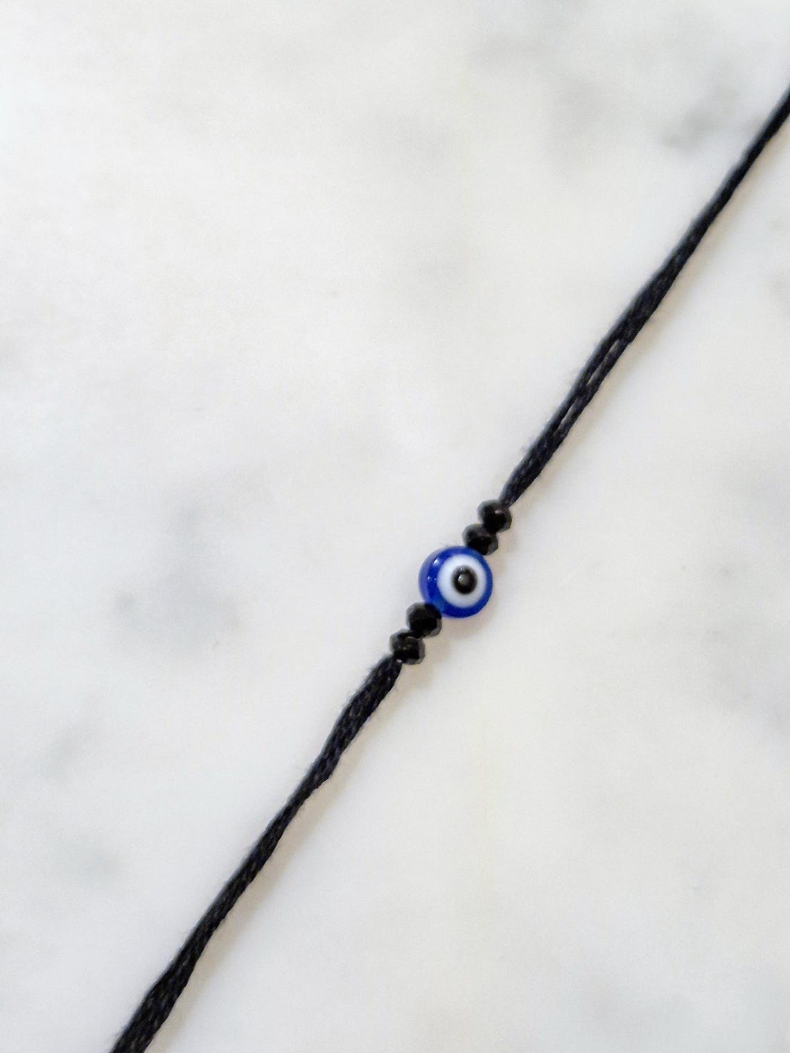 Evil Eye Bead & Crystal Rakhi/ Friendship Band / Anklet on Coloured ...