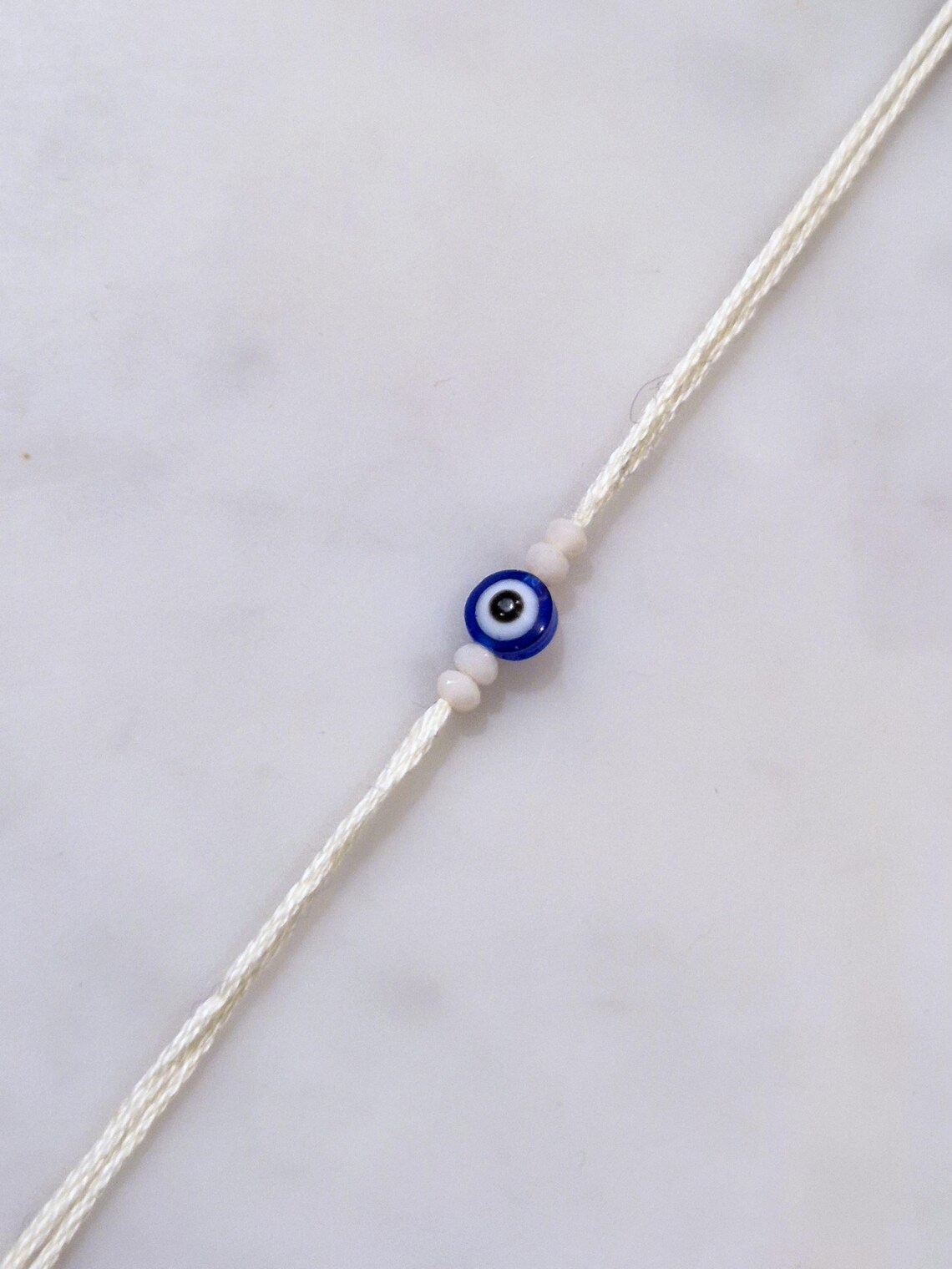 Evil Eye Bead & Crystal Rakhi/ Friendship Band / Anklet on Coloured ...