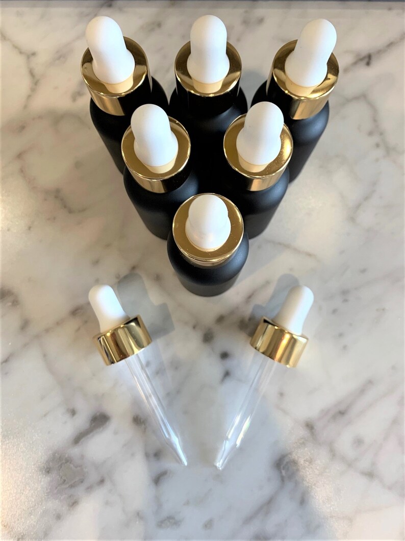 2 Oz. (60 ML) Black Matte Boston Round Glass Bottle With Gold Glass ...