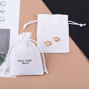 100 Pcs of White Small Cotton Drawstring Pouches | Customized Jewellery ...