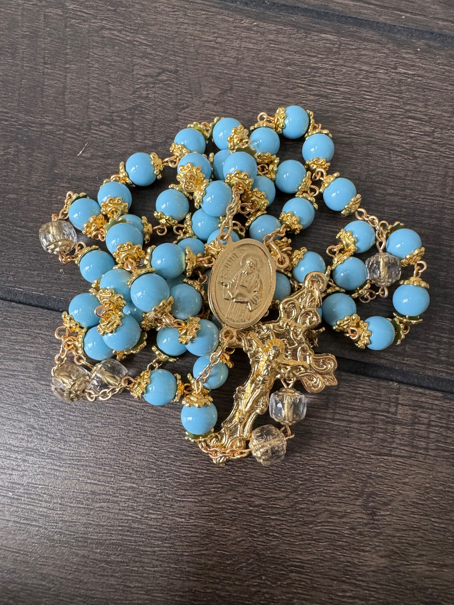Heavenly Whisper: Handcrafted Gold Rosary With Baby Blue Beads & Saint ...