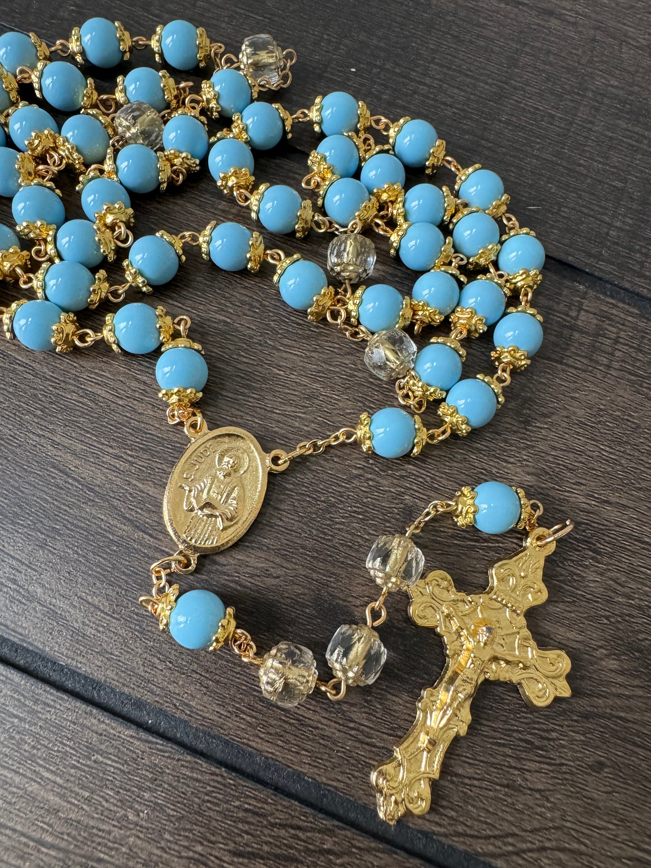 Heavenly Whisper: Handcrafted Gold Rosary With Baby Blue Beads & Saint ...