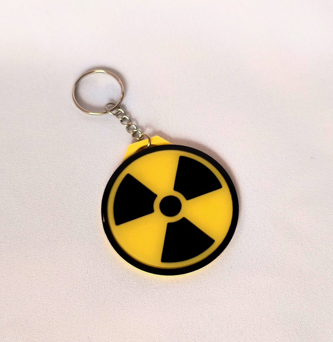 Radiation Symbol Keychain in Multiple Colors Variation 2.5 Inchesl ...
