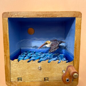 Pelican Automata. Oil Painting and Bird Flying Over the Sea, Kinetic ...