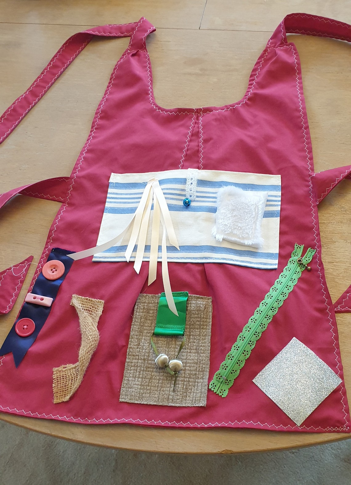 Childrens activity apron autism fiddle pinny | Etsy