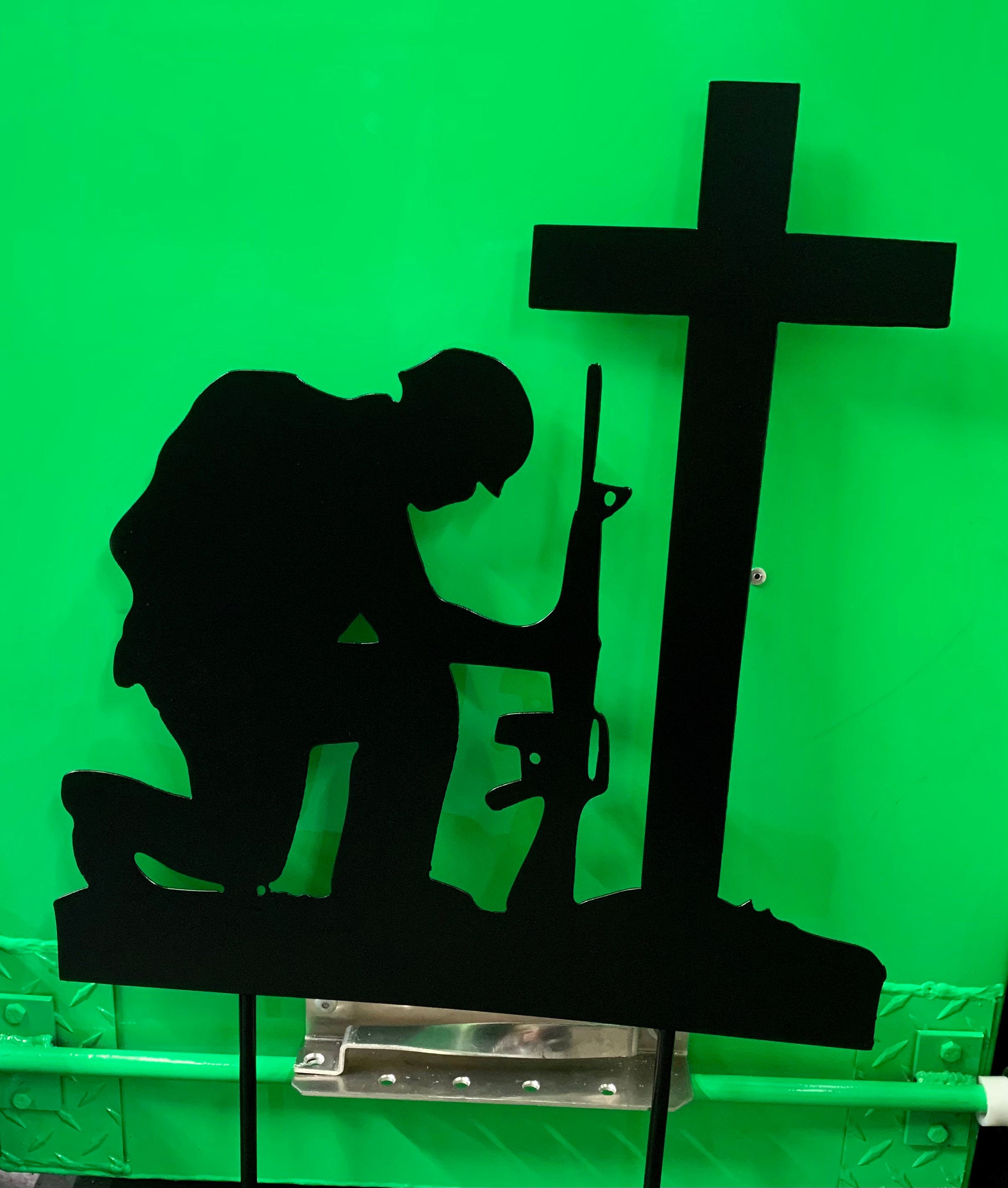 Soldier Kneeling At Cross Statue