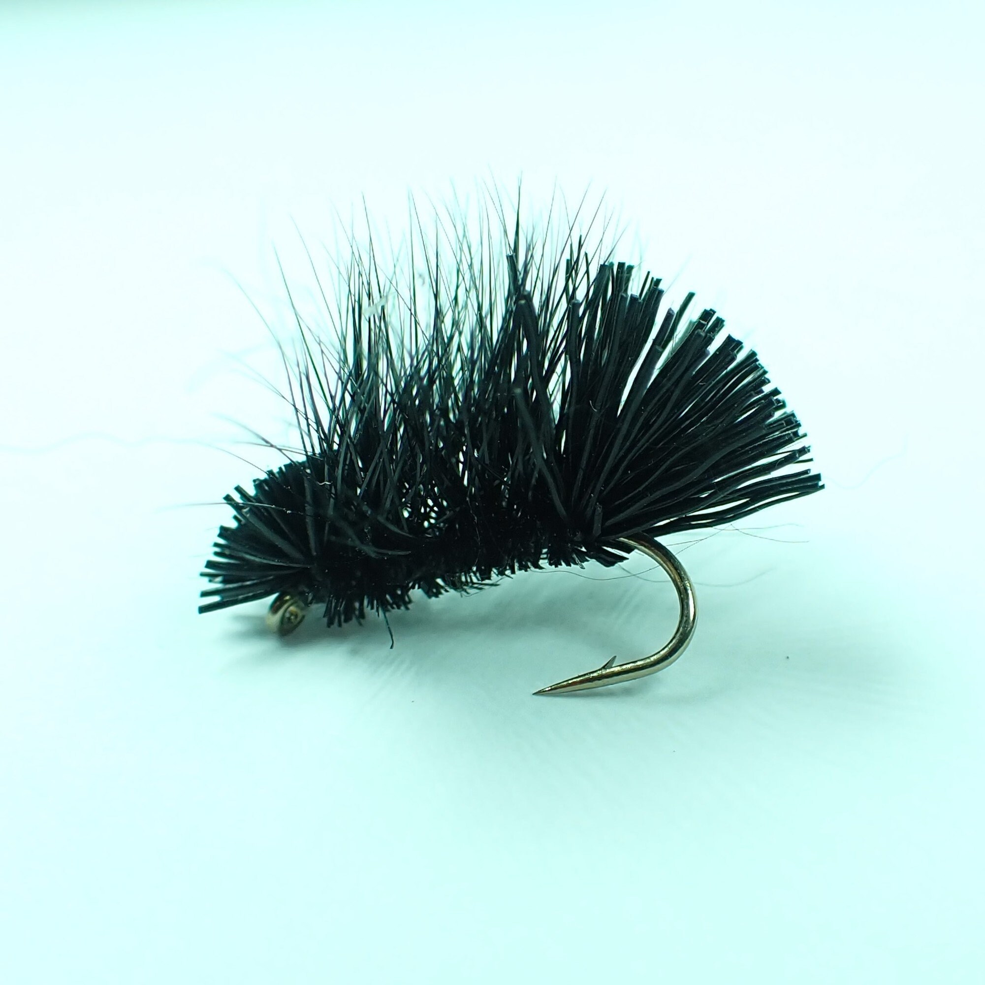 Dyret Hackle Hog, black barbed fishing fly, caddis pattern that will ...