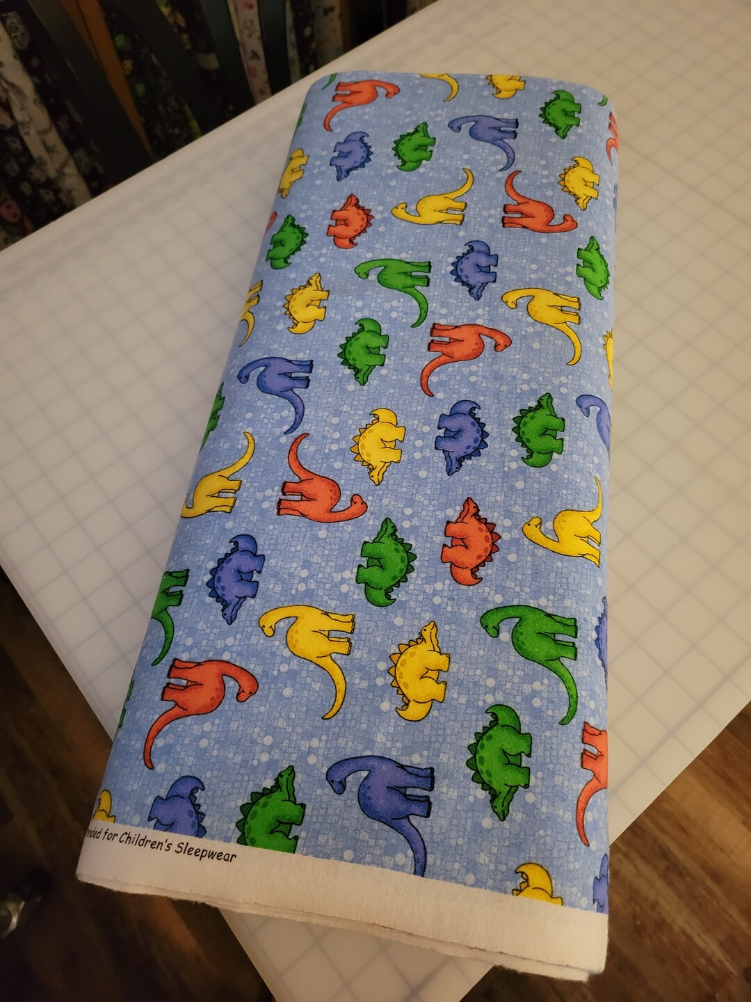 Bright, Colorful Dinosaurs on Blue Comfy Cotton FLANNEL by A. E. Nathan ...