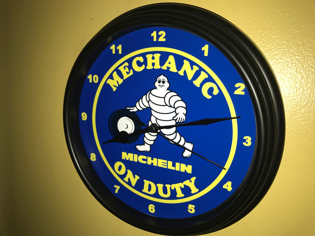 Michelin Tires Mechanic on Duty Service Gas Station Garage Bar ...