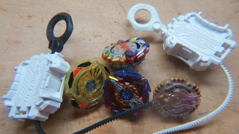 Beyblade Lot of 4 Beyblades, 2 Launchers - Etsy