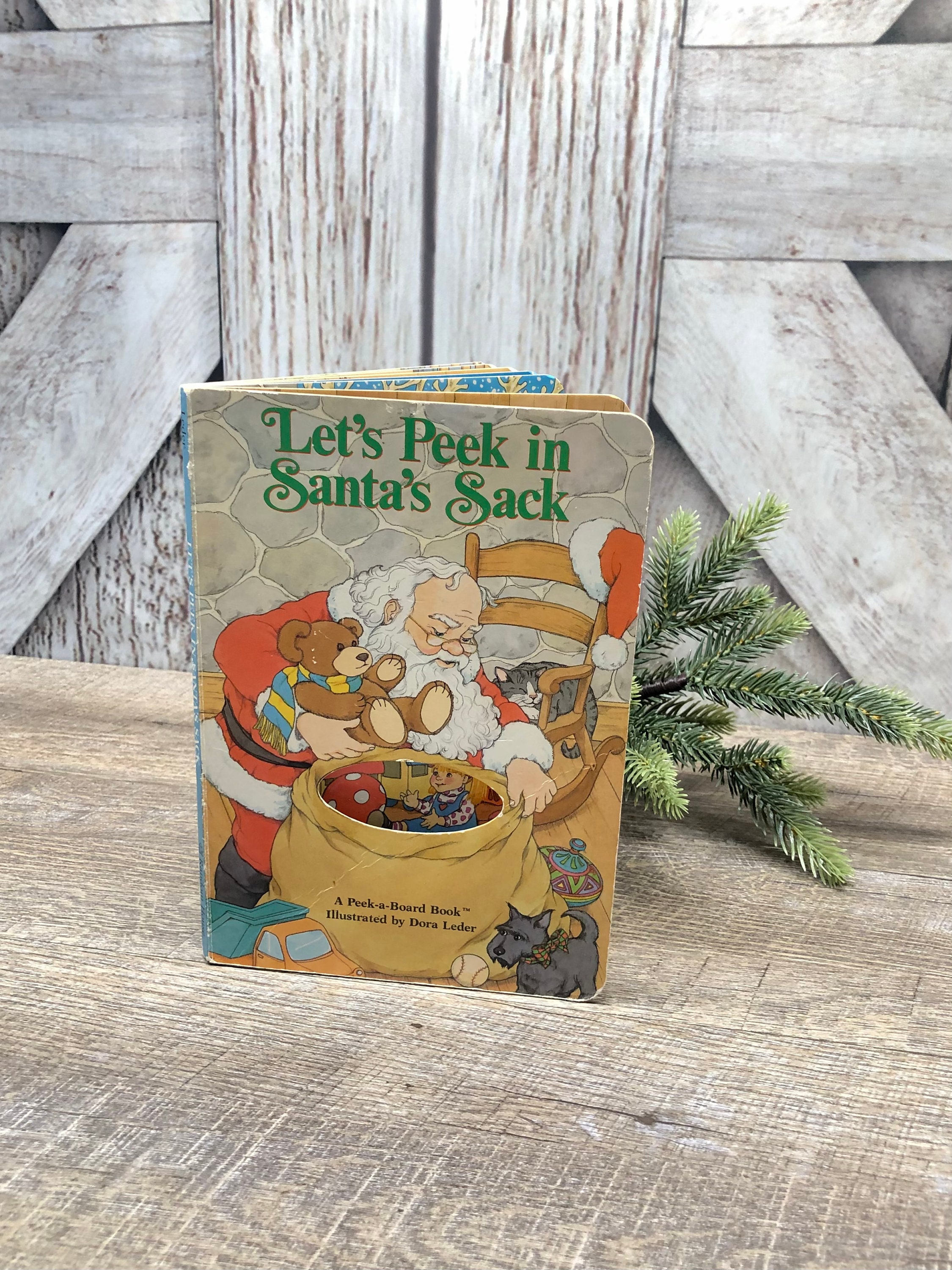 Lets Peek in Santa's Sack Peek-a-board Book Children's Christmas Book ...